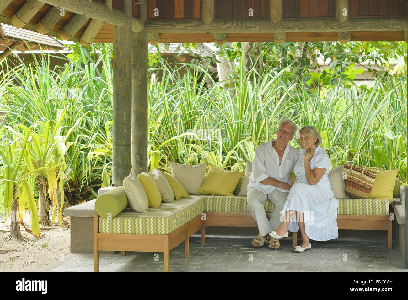 elderly couple rest at tropical resort Stock Photo - Alamy