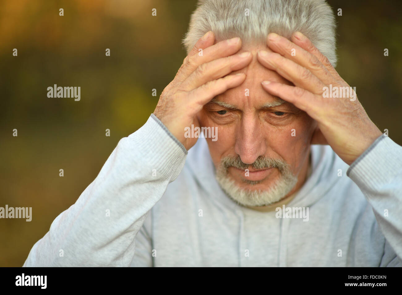 sad senior man in park Stock Photo - Alamy