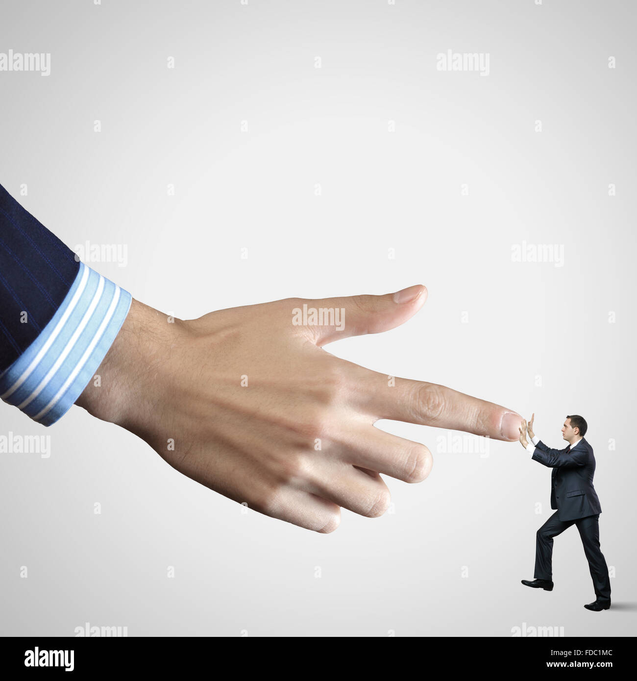 Giant human hand holding miniature hi-res stock photography and images ...