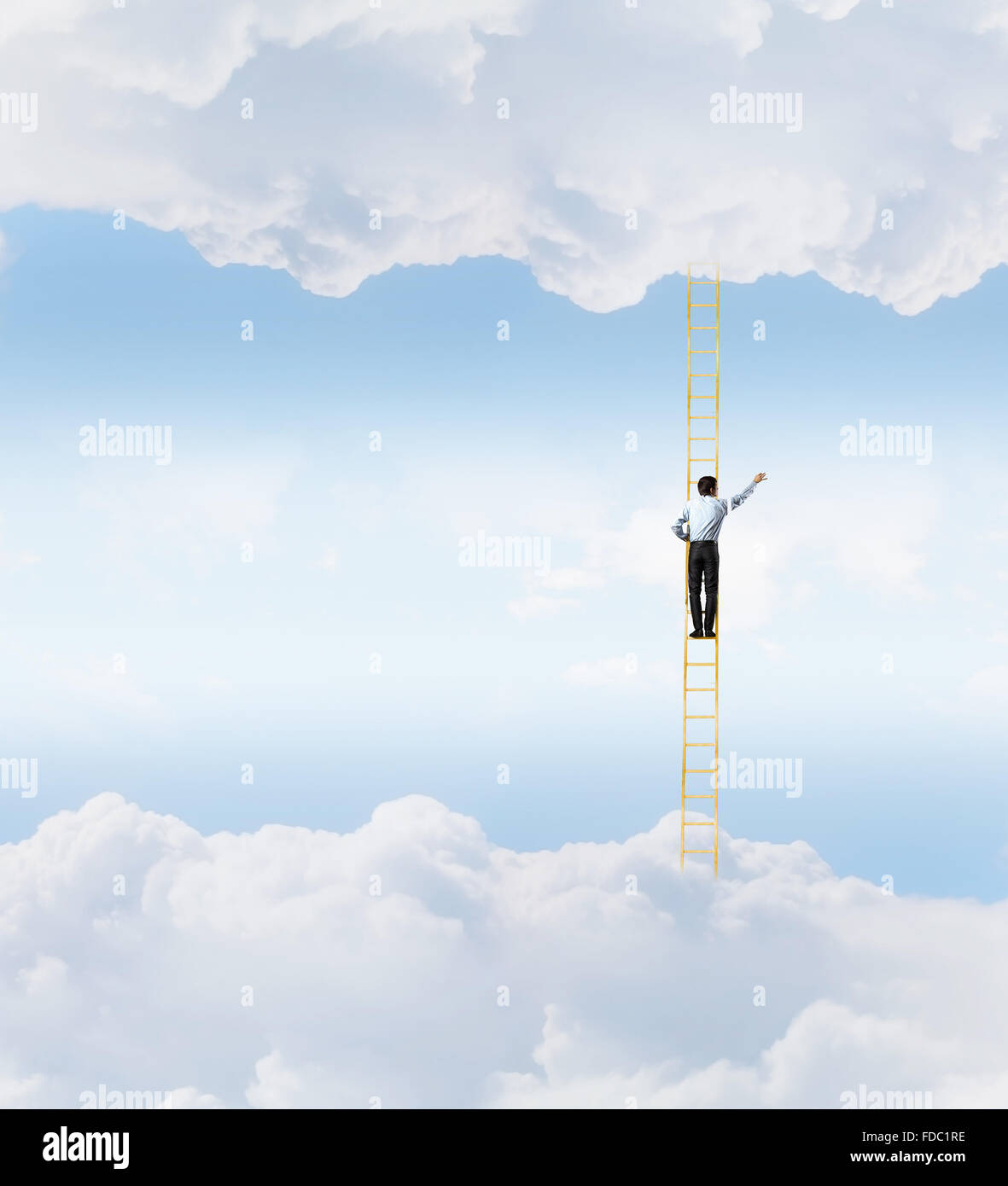 Businessman standing on ladder high in sky Stock Photo - Alamy
