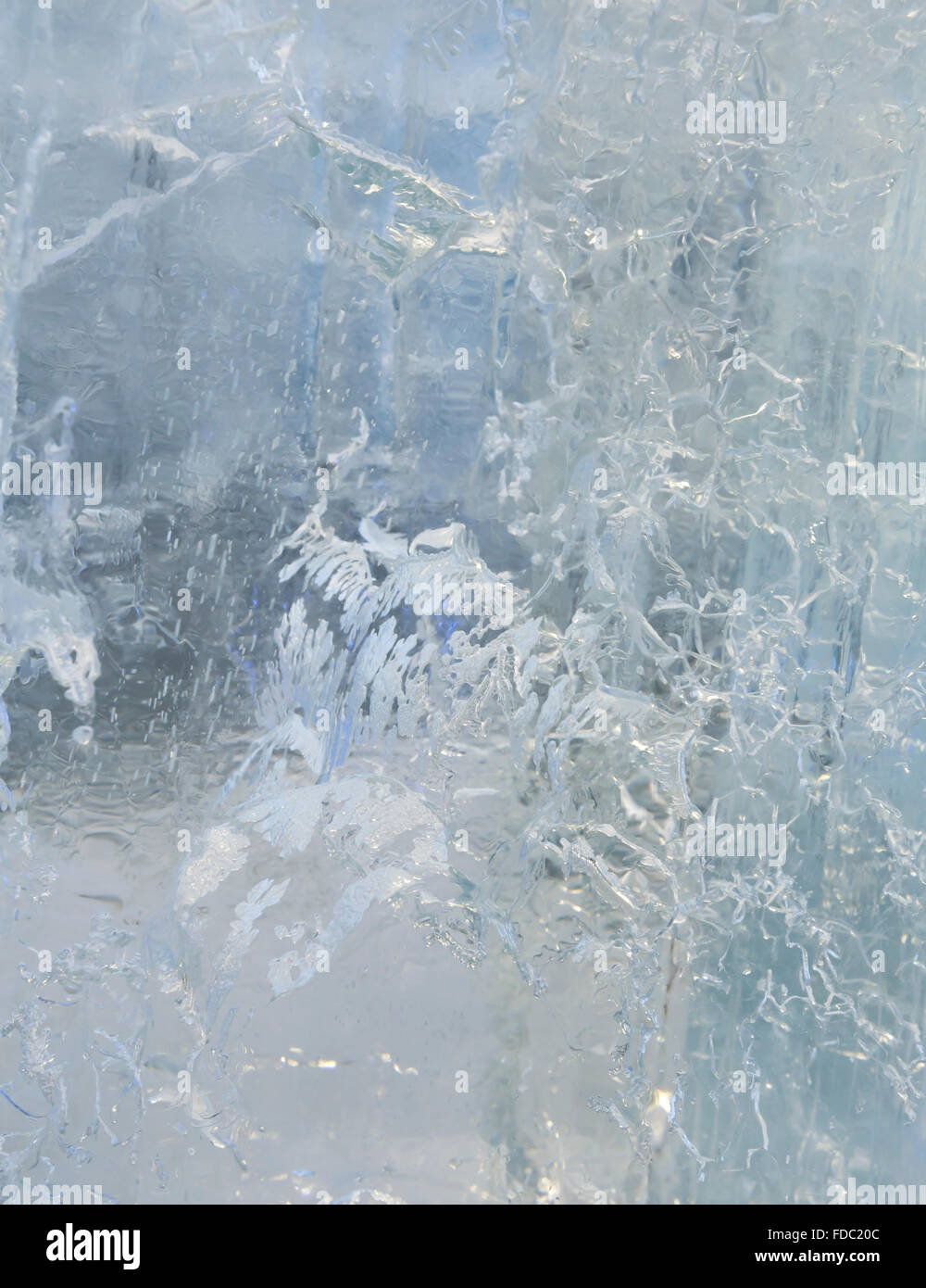 Glacial transparent wall of ice with interesting drawings and patterns ...