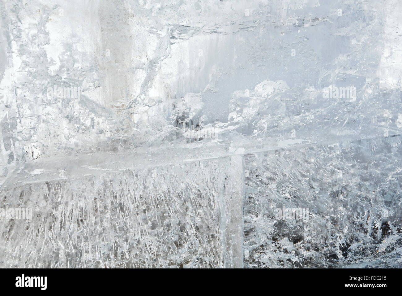 Glacial transparent wall of ice with interesting drawings and patterns ...