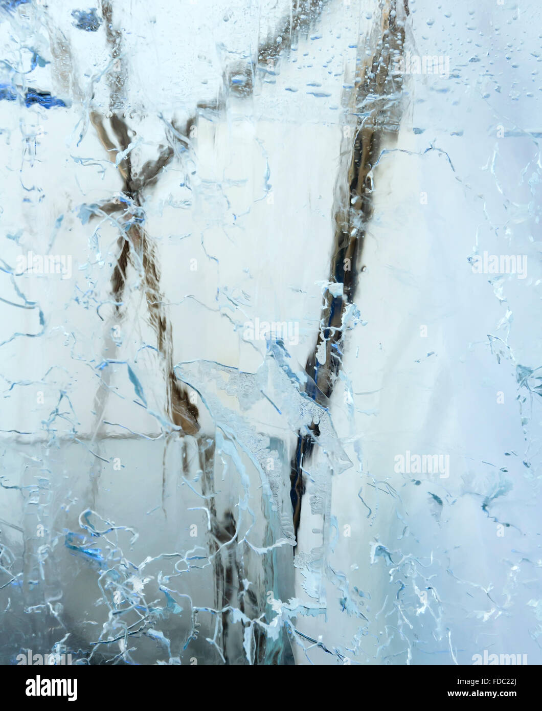 Glacial transparent wall of ice with interesting drawings and patterns ...