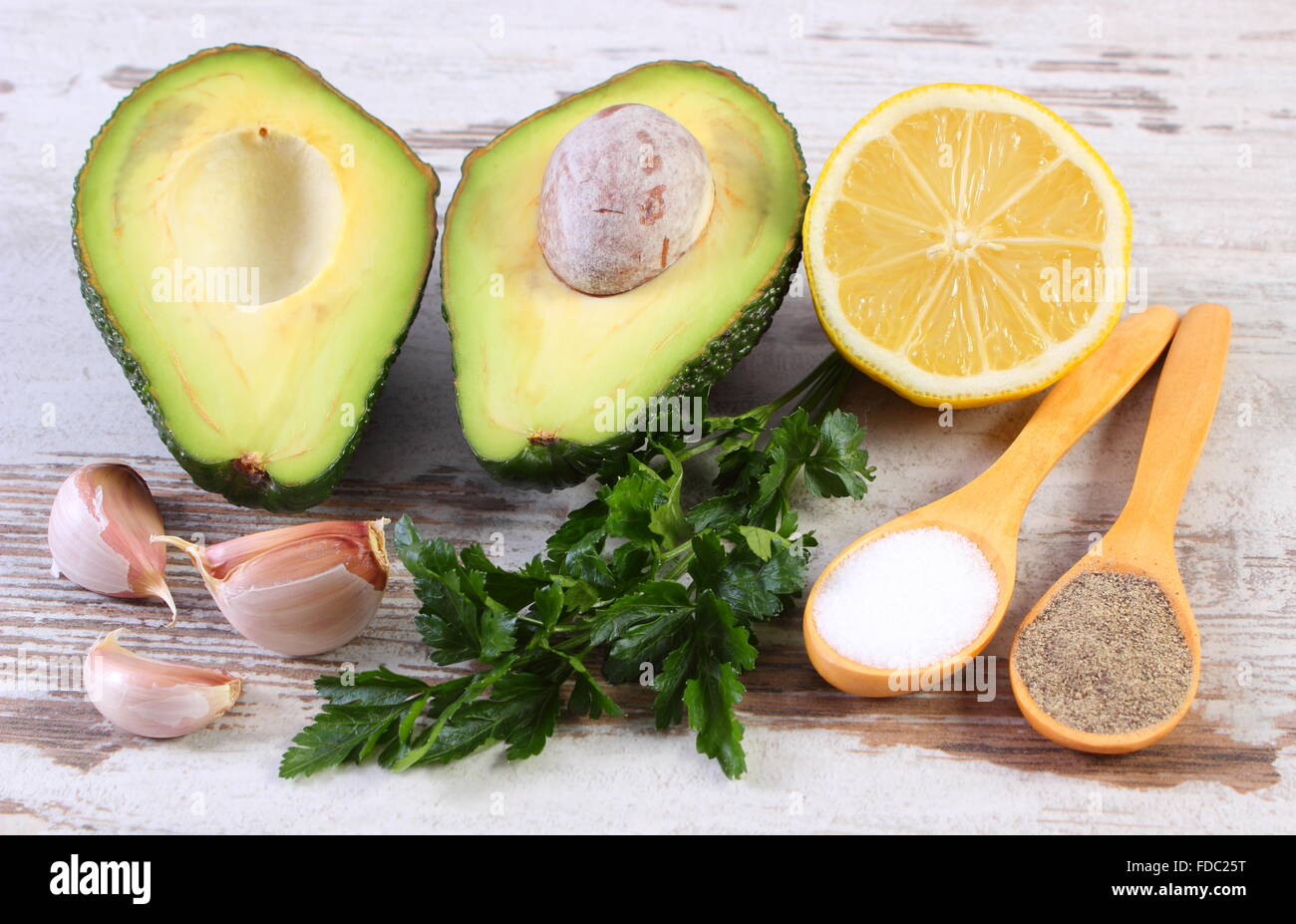 Avocado with ingredients and spices to avocado paste or guacamole ...