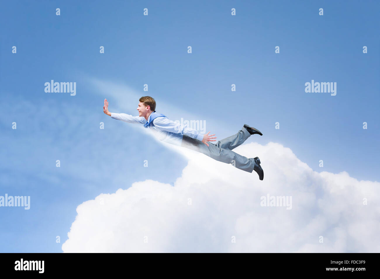 Young super businessman flying high in sky Stock Photo - Alamy