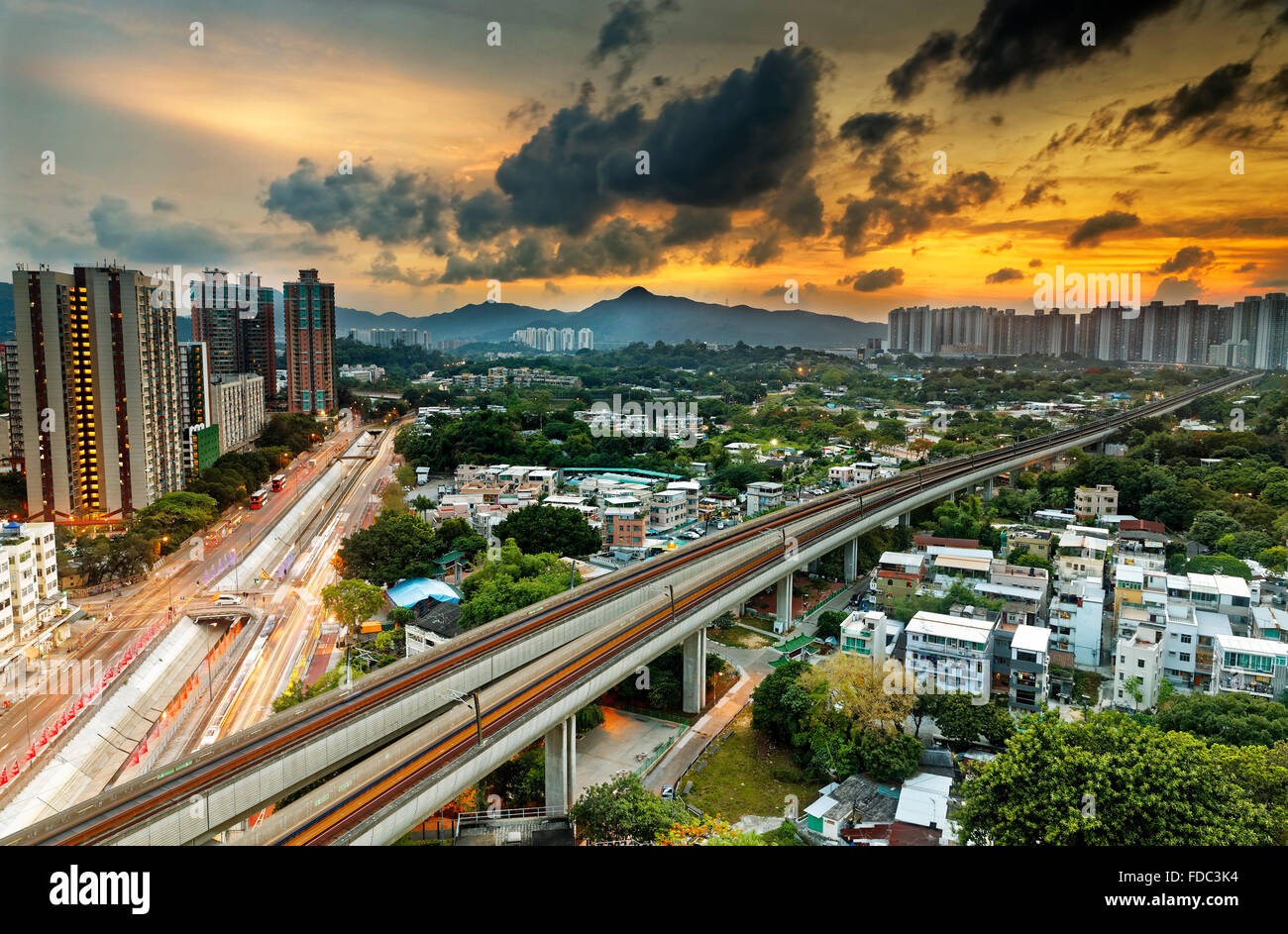 hong kong cityspace and speed train at sunset Stock Photo - Alamy