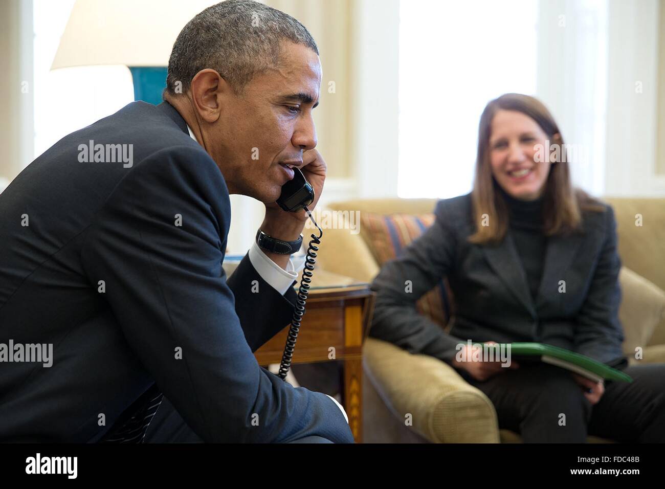 U.S. President Barack Obama talks on the phone with a person who has ...