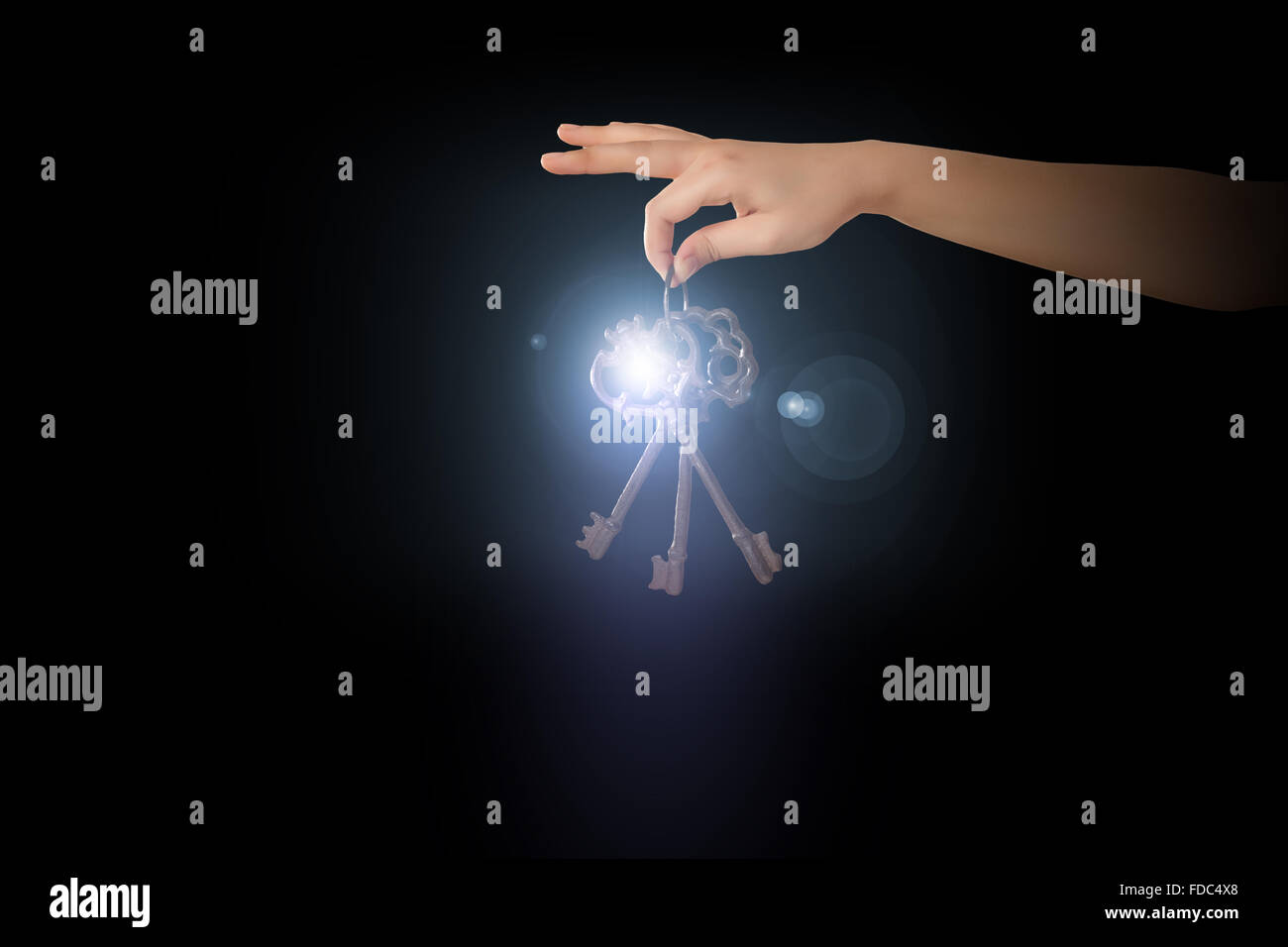 Close up of woman hand holding golden key Stock Photo - Alamy