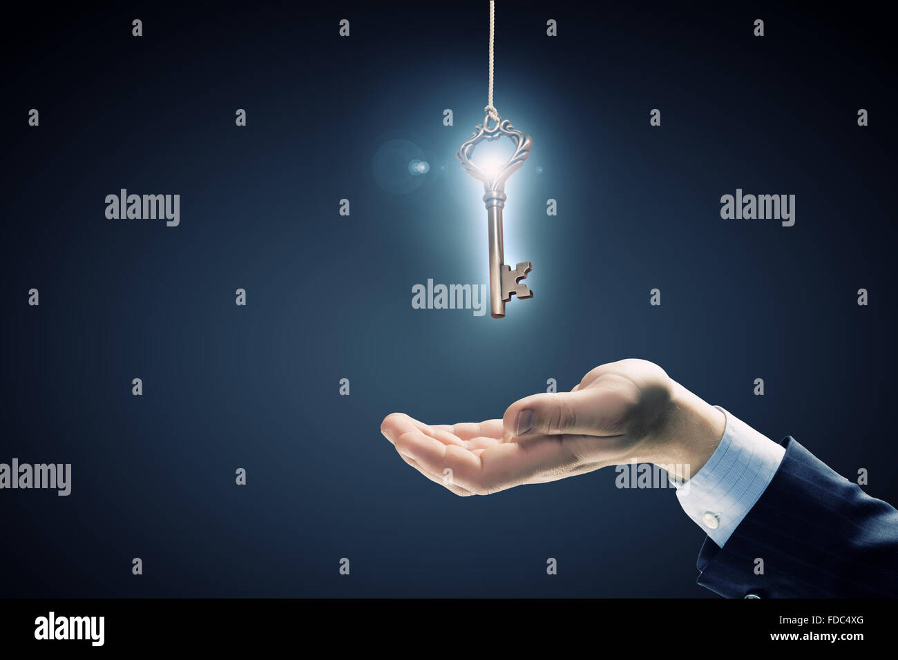 Close up of human hand holding key Stock Photo - Alamy