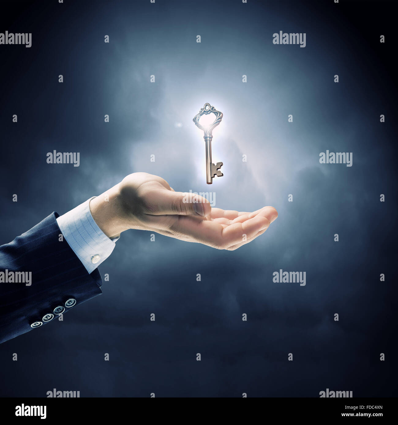 Close up of human hand holding key Stock Photo - Alamy