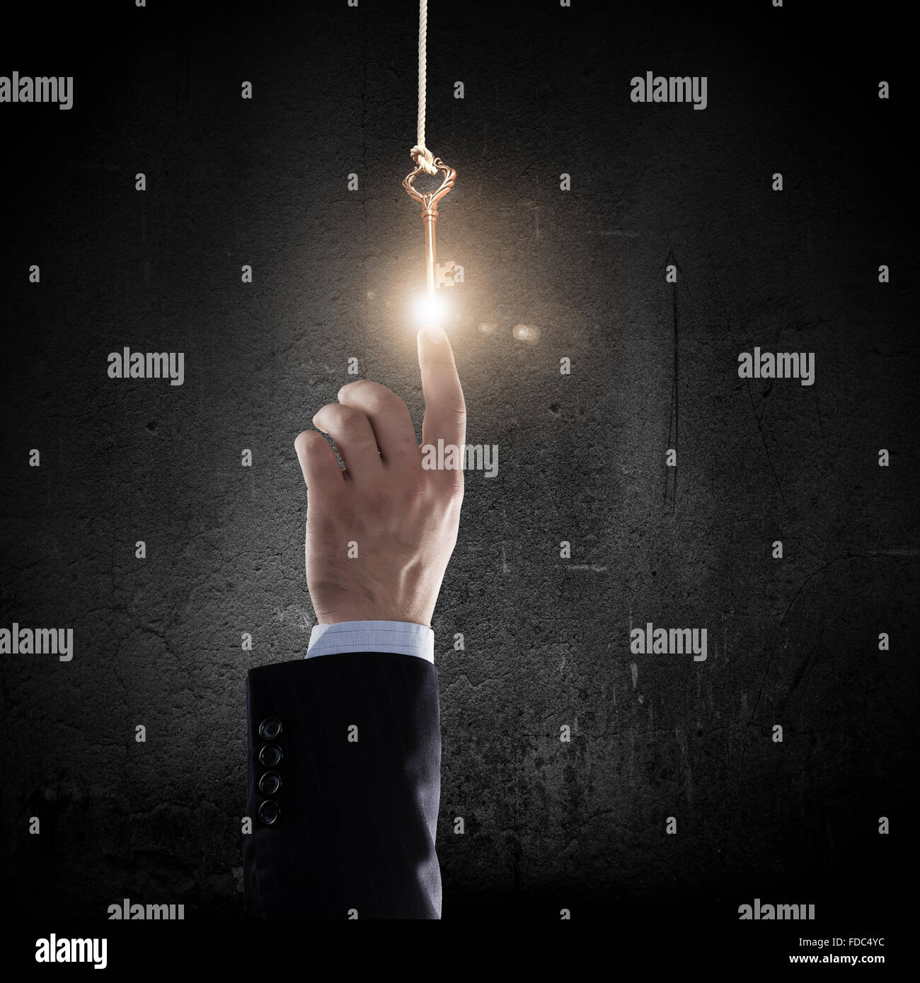 Close up of human hand touching key Stock Photo - Alamy