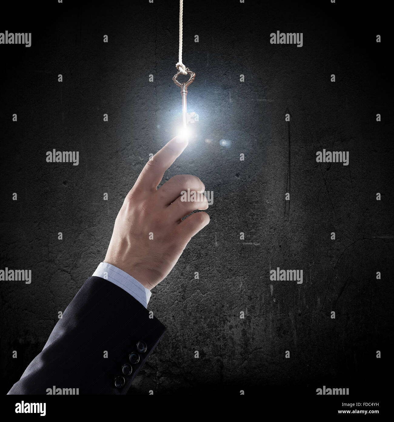 Close up of human hand touching key Stock Photo - Alamy