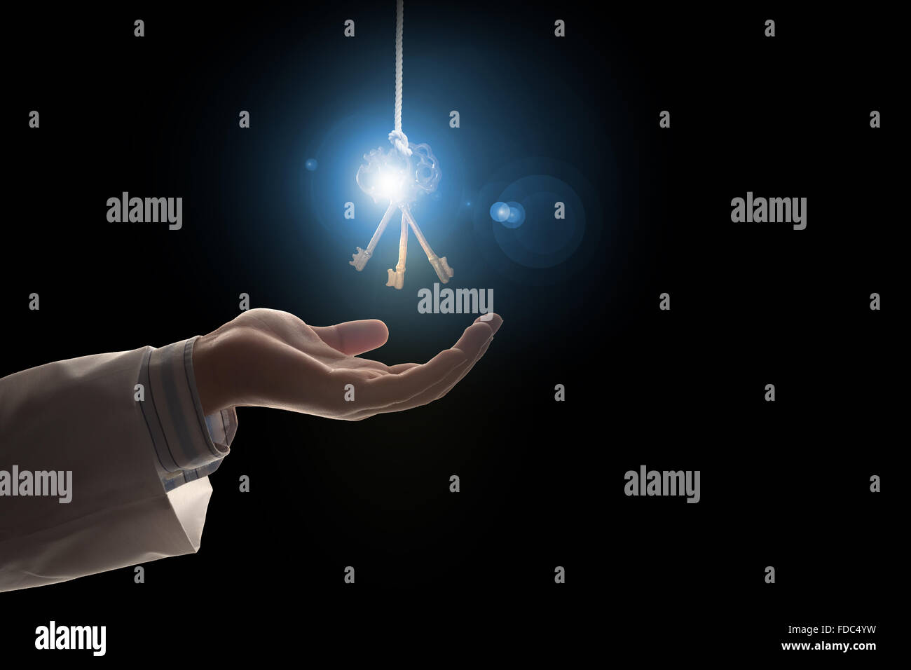 Close up of human hand holding key Stock Photo - Alamy