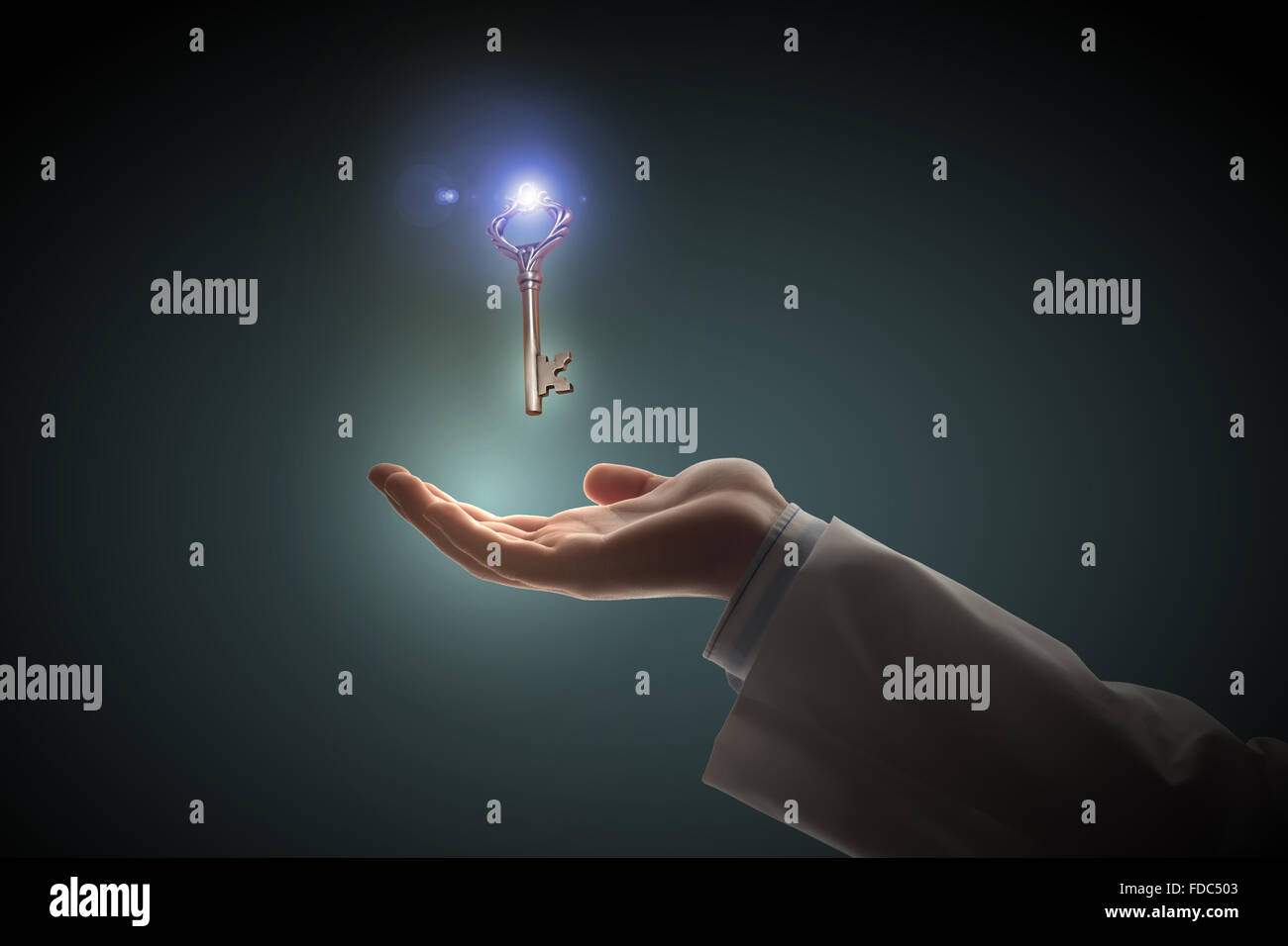 Close up of human hand holding key Stock Photo - Alamy