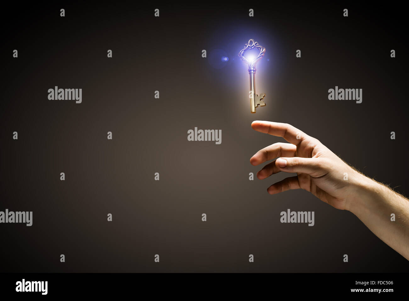 Close up of human hand touching key Stock Photo - Alamy