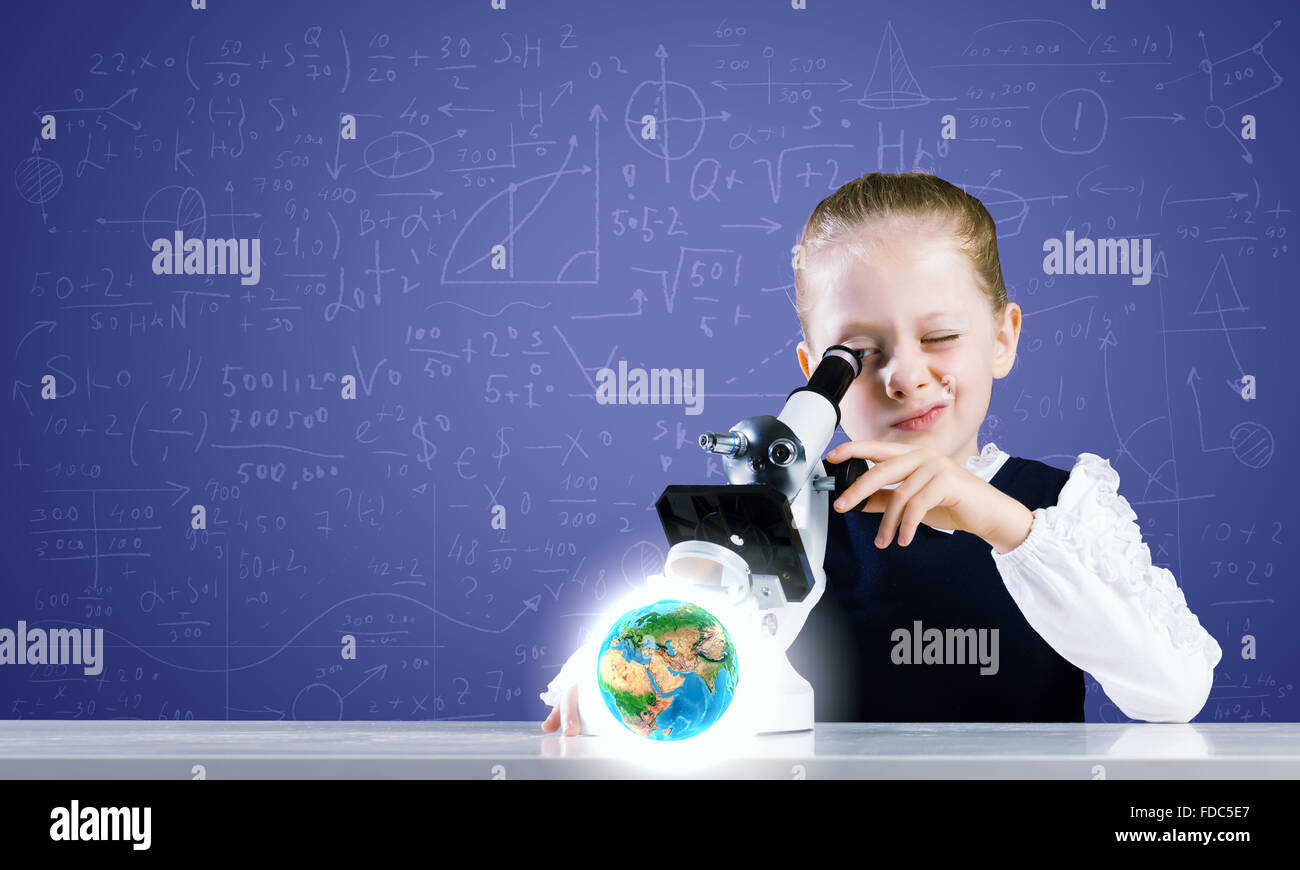 Cute girl with microscope against blackboard. Elements of this image ...