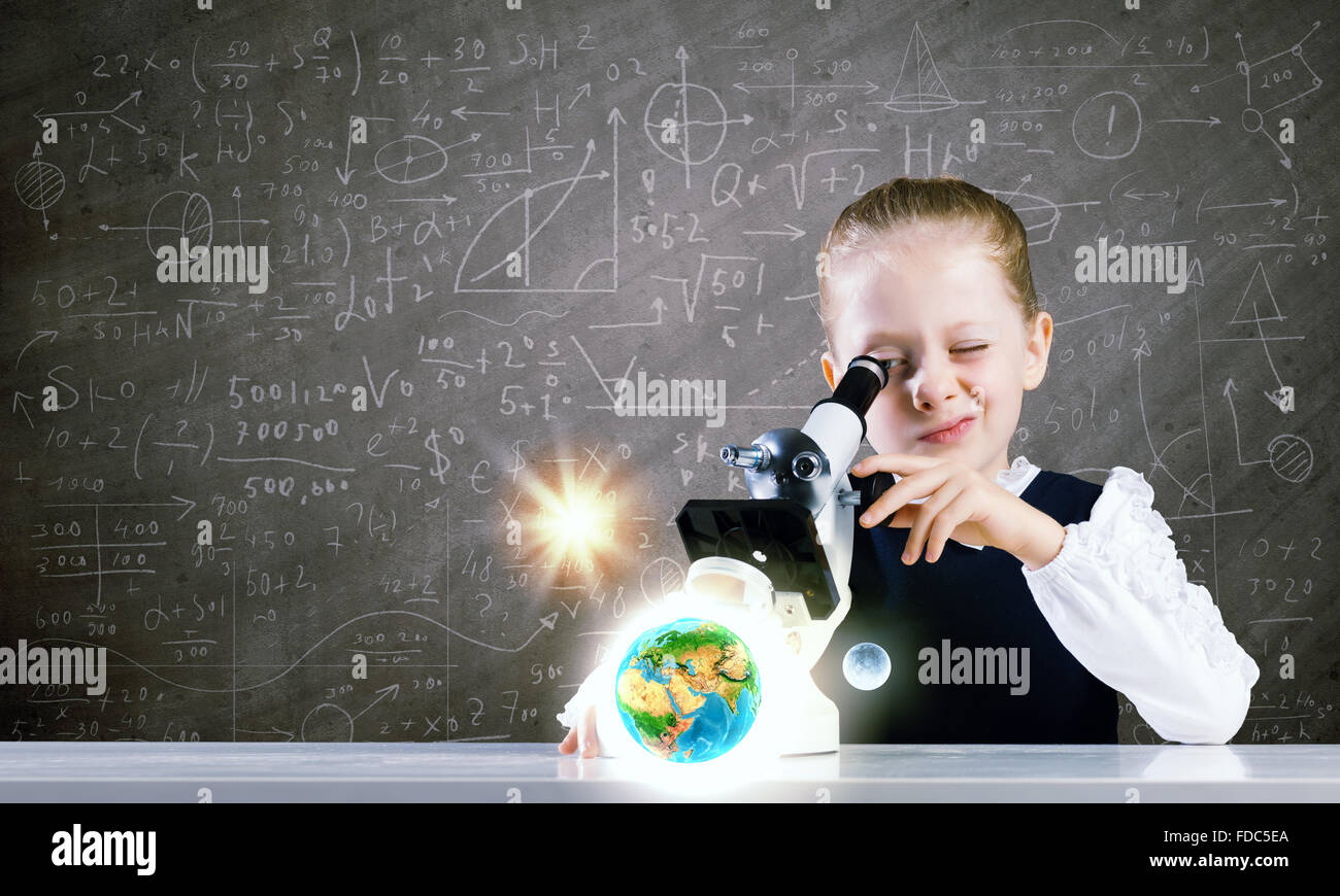Cute girl with microscope against blackboard. Elements of this image ...