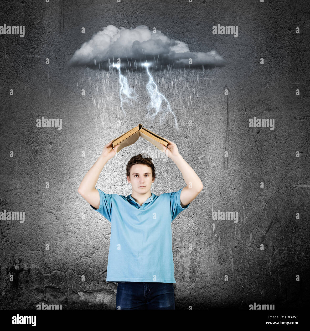 Young man with opened book. Reading and education Stock Photo - Alamy