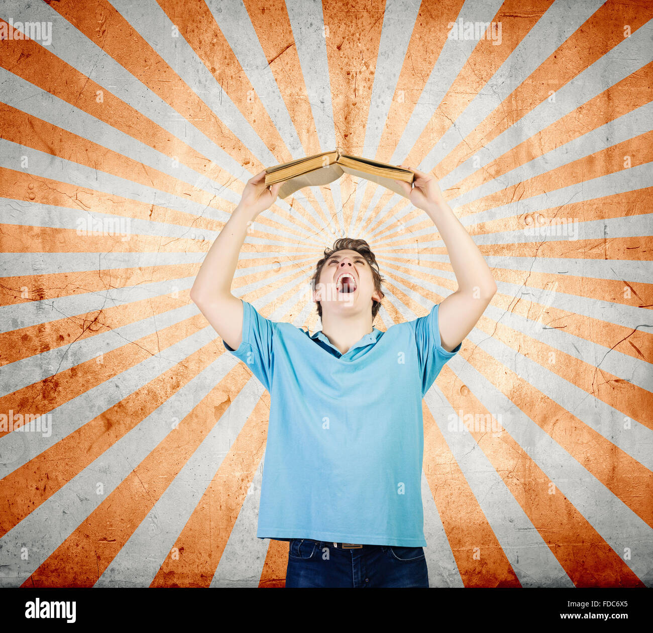 Young man with opened book. Reading and education Stock Photo - Alamy