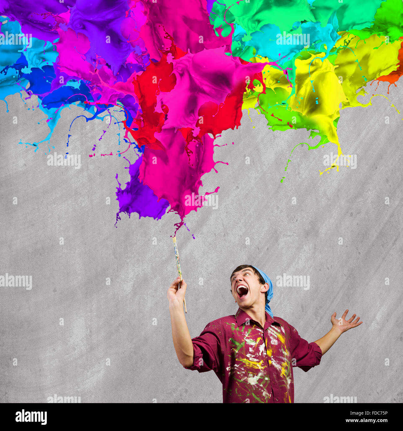 Young handsome man painter with brush in hand Stock Photo - Alamy