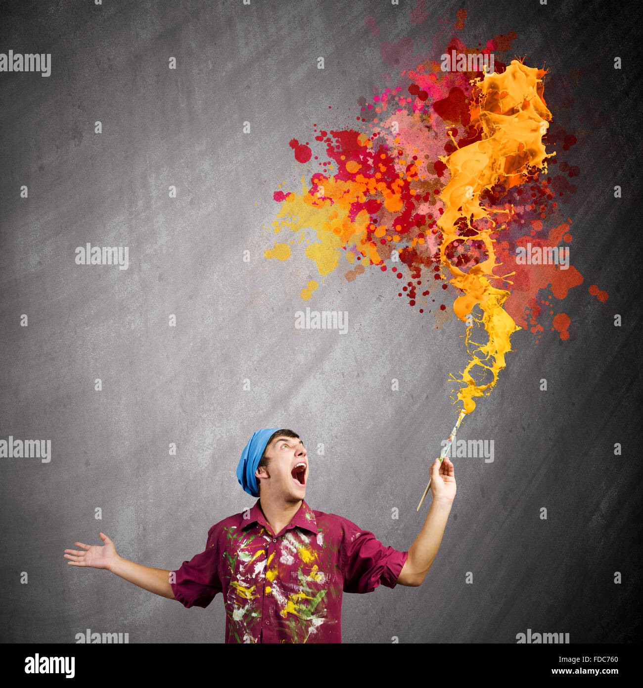 Young handsome man painter with brush in hand Stock Photo - Alamy