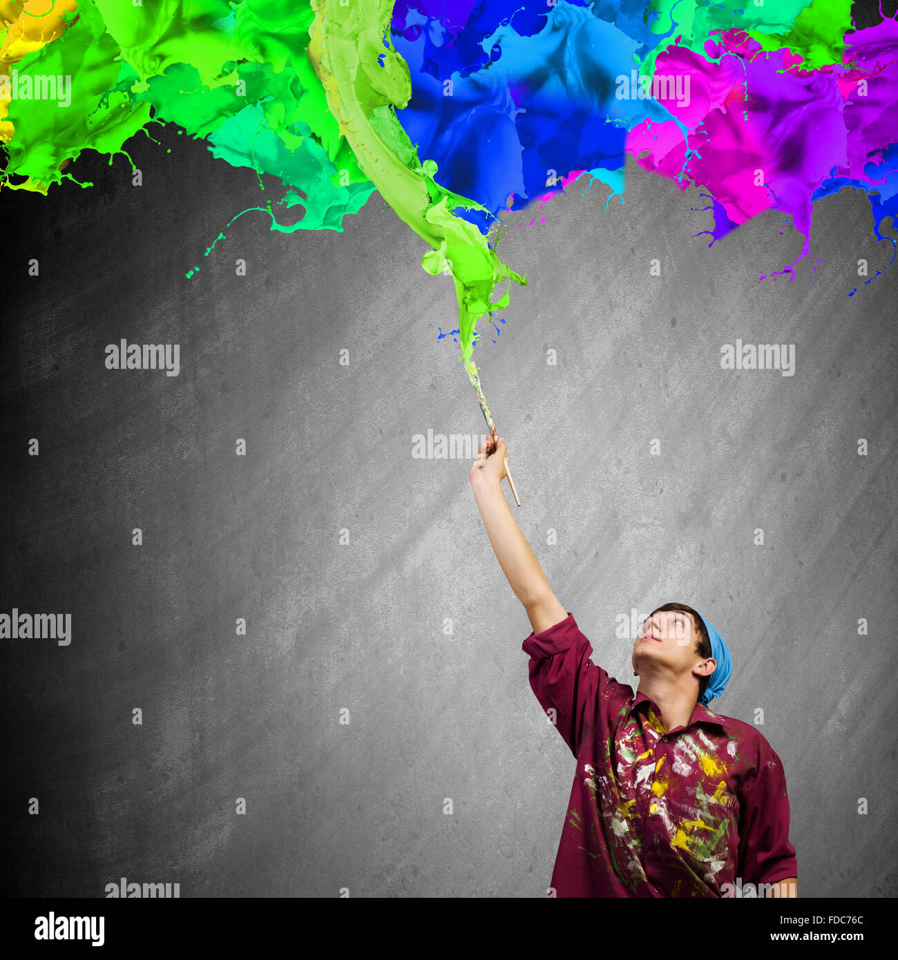 Young handsome man painter with brush in hand Stock Photo - Alamy