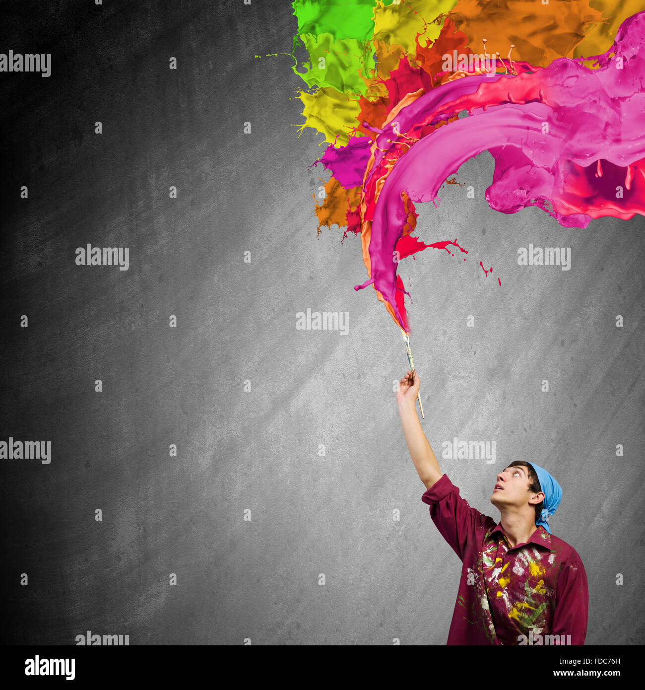 Young handsome man painter with brush in hand Stock Photo - Alamy