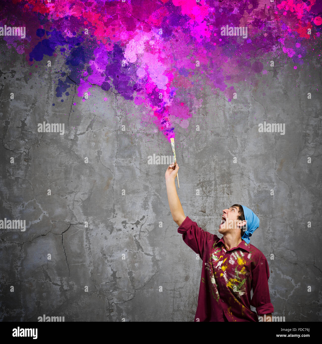 Young handsome man painter with brush in hand Stock Photo - Alamy