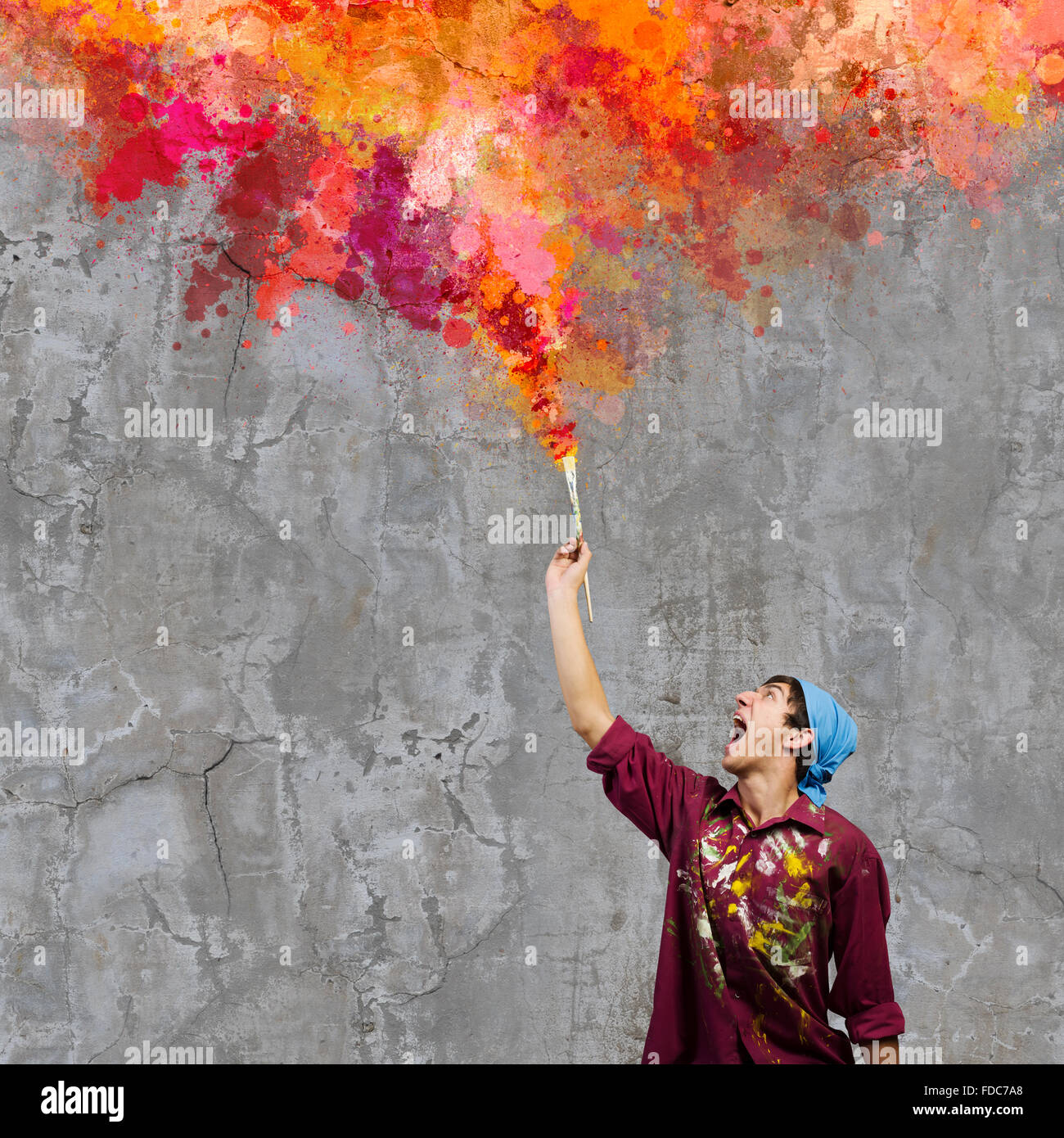 Young handsome man painter with brush in hand Stock Photo - Alamy