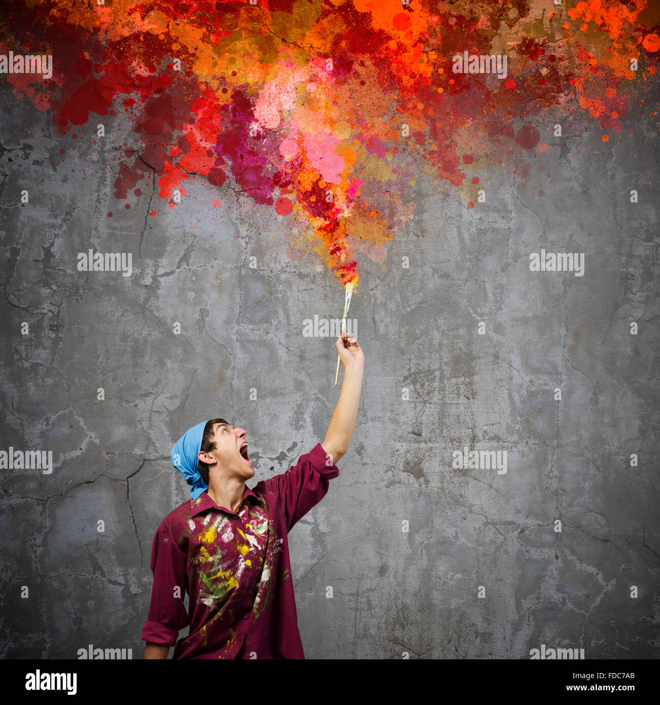Young handsome man painter with brush in hand Stock Photo - Alamy