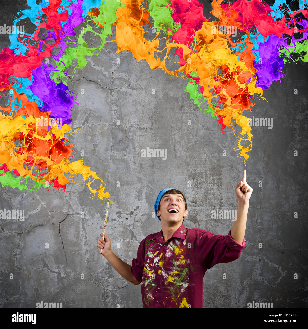Young handsome man painter with brush in hand Stock Photo - Alamy