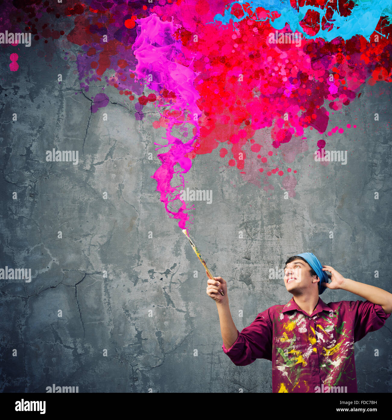 Young handsome man painter with brush in hand Stock Photo - Alamy