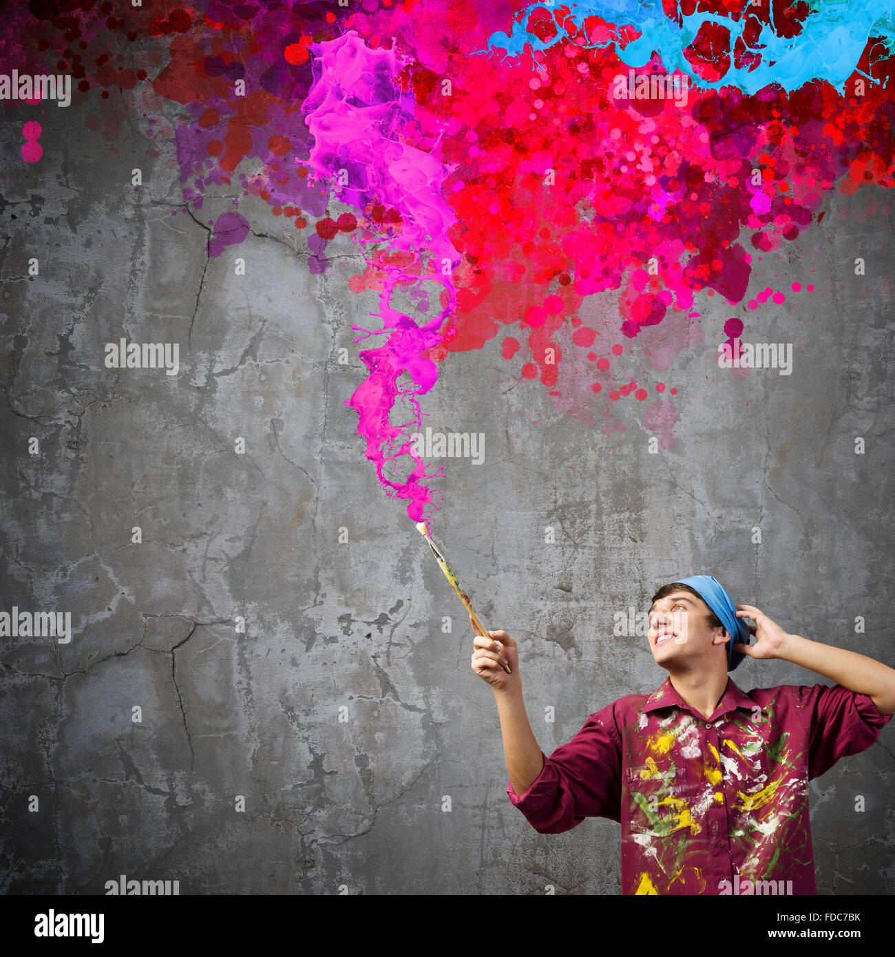 Young handsome man painter with brush in hand Stock Photo - Alamy