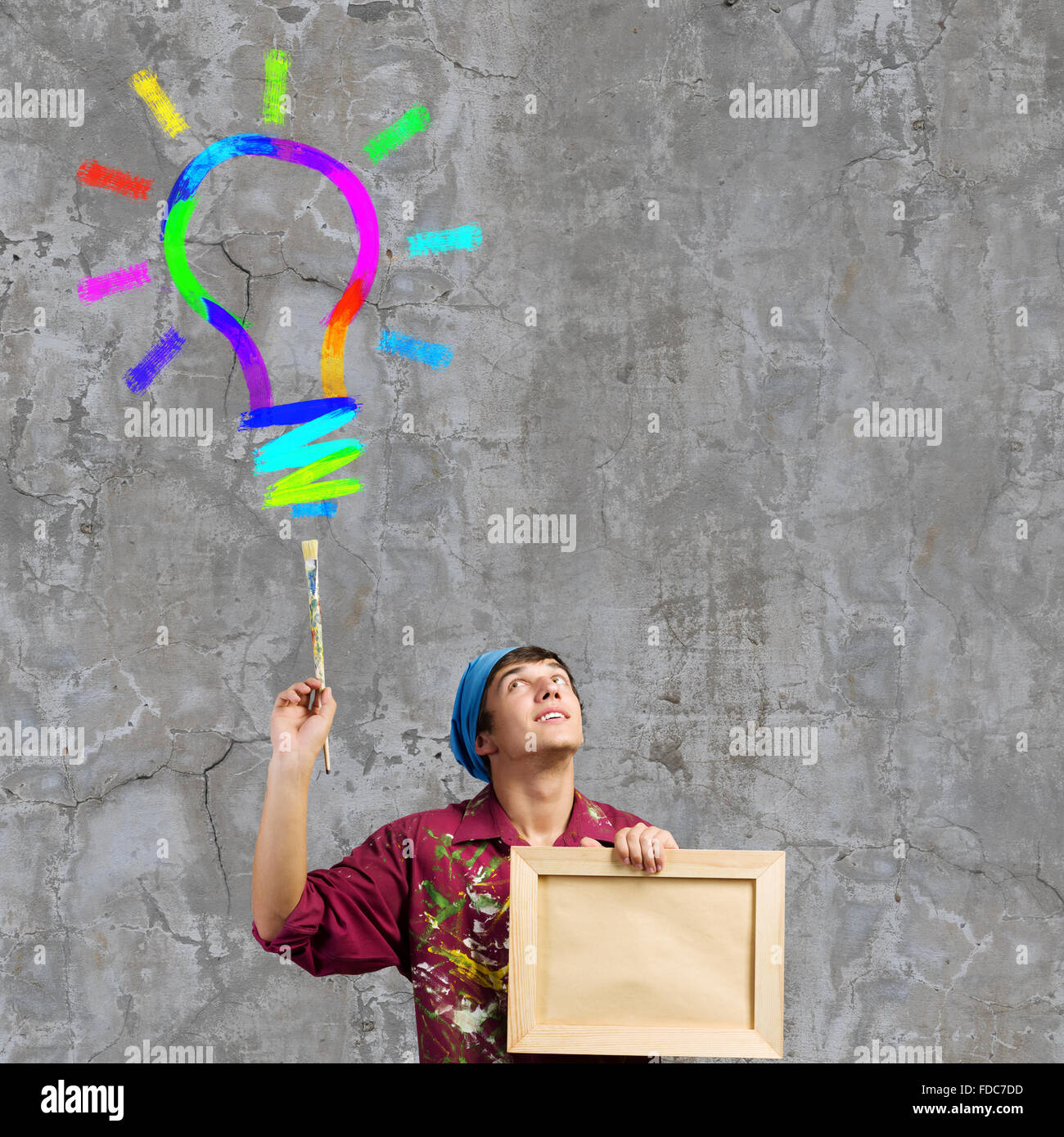 Young handsome man painter with brush in hand Stock Photo - Alamy