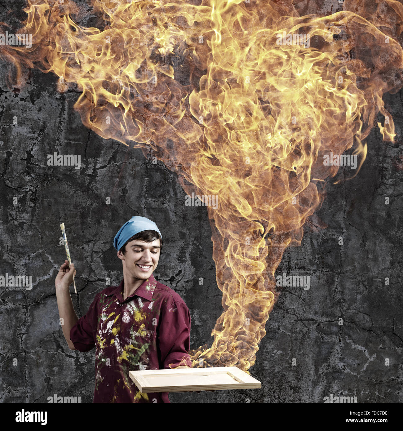 Young handsome man painter with brush in hand Stock Photo - Alamy