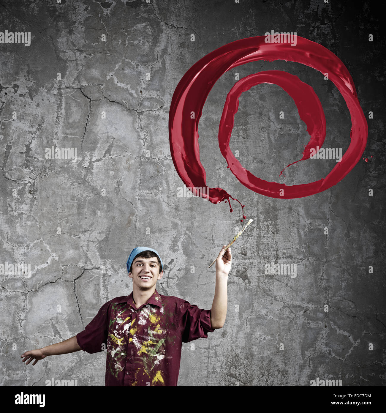 Young handsome man painter with brush in hand Stock Photo - Alamy