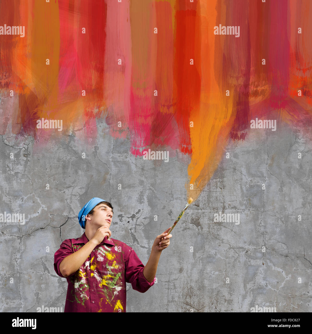 Young handsome man painter with brush in hand Stock Photo - Alamy