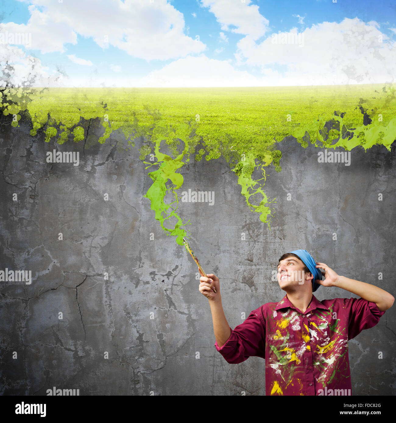 Young handsome man painter with brush in hand Stock Photo - Alamy