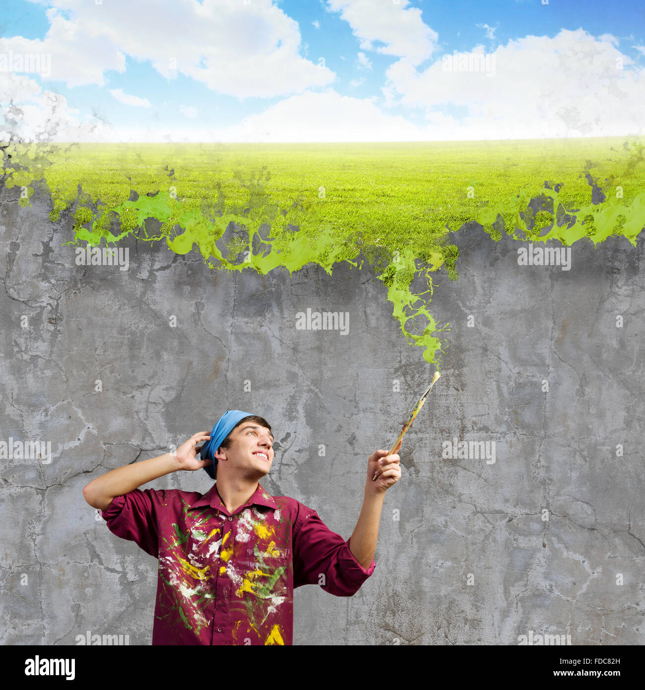 Young handsome man painter with brush in hand Stock Photo - Alamy