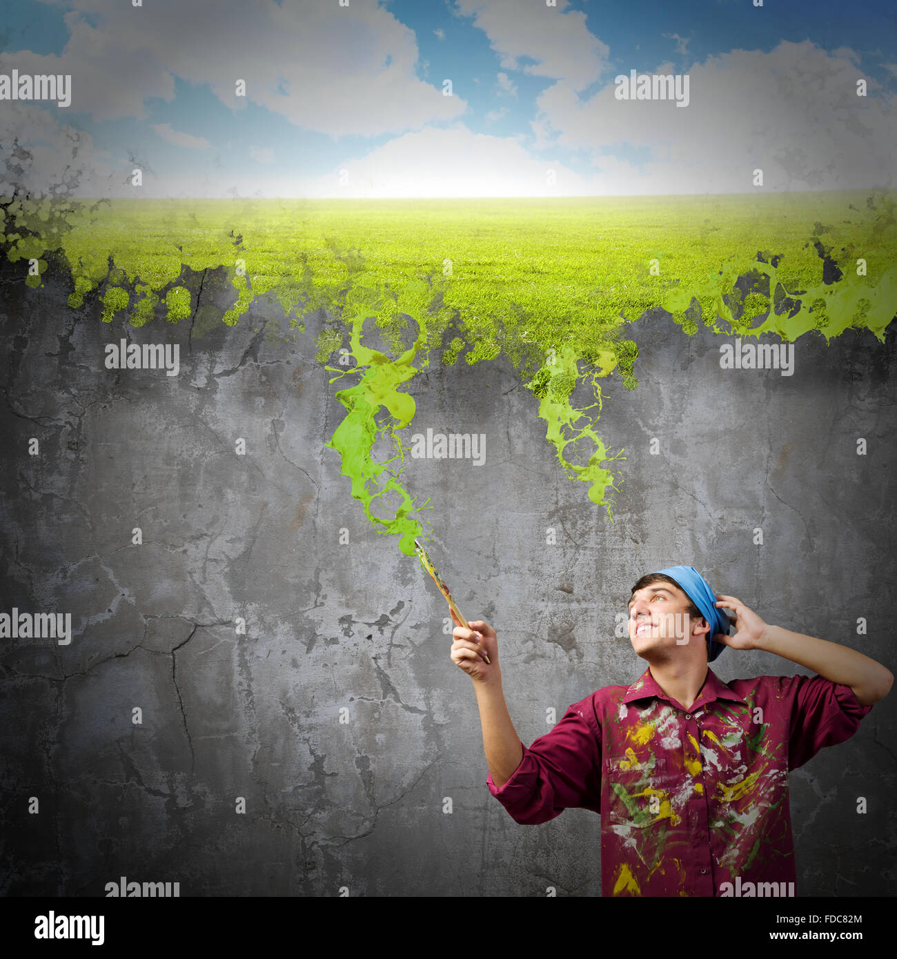 Young handsome man painter with brush in hand Stock Photo - Alamy