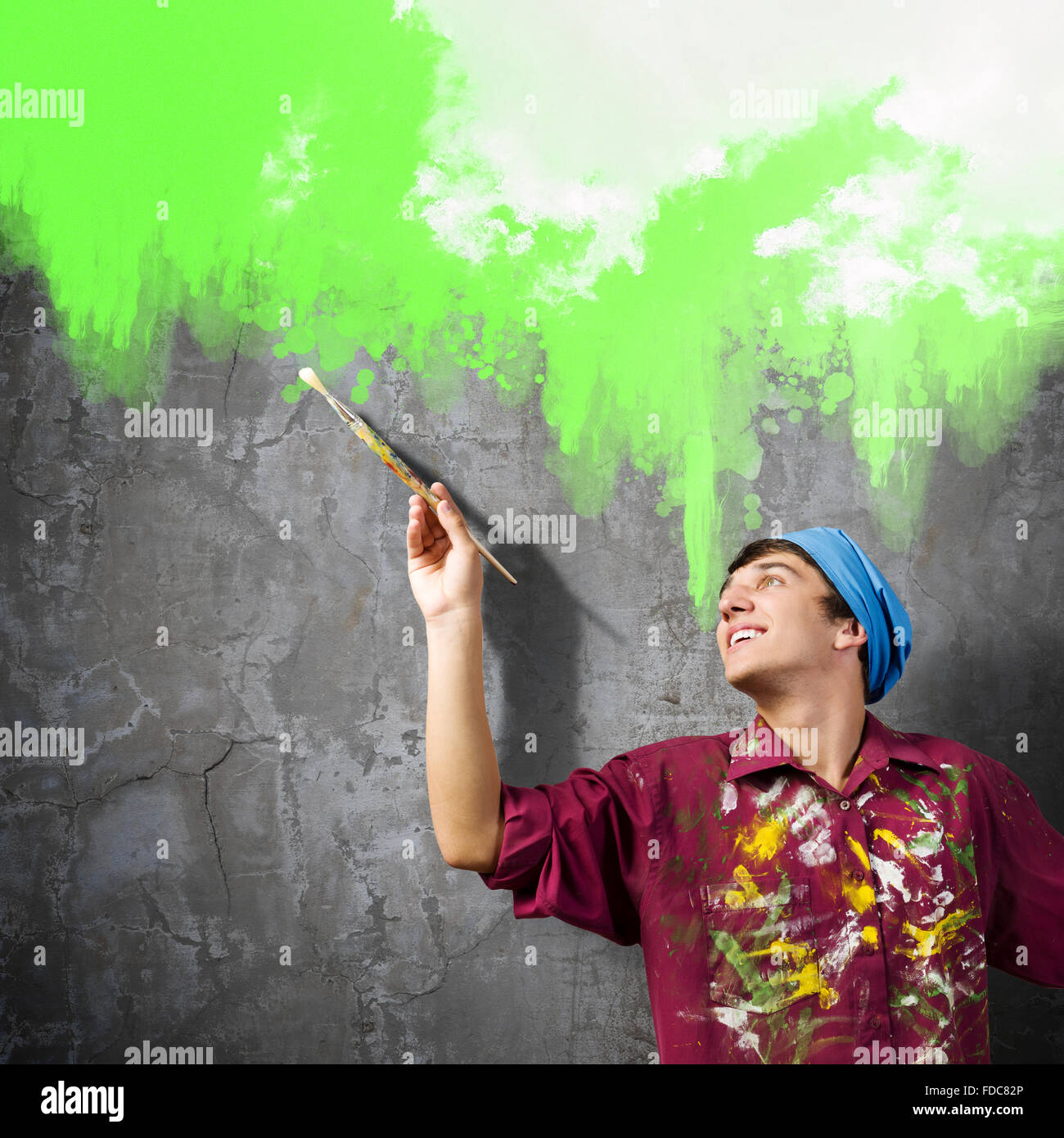 Young handsome man painter with brush in hand Stock Photo - Alamy