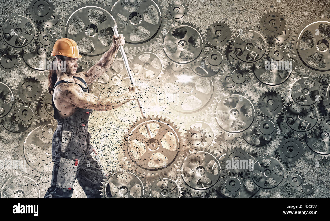 Strong man mechanic in uniform with spanner fixing mechanism Stock ...