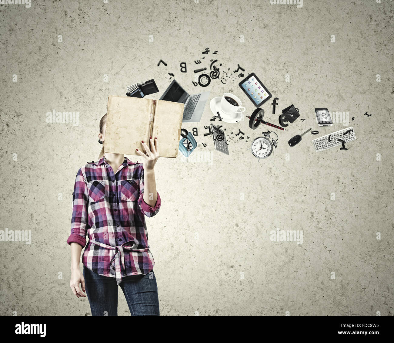 Young woman in casual hiding face behind reading Stock Photo - Alamy