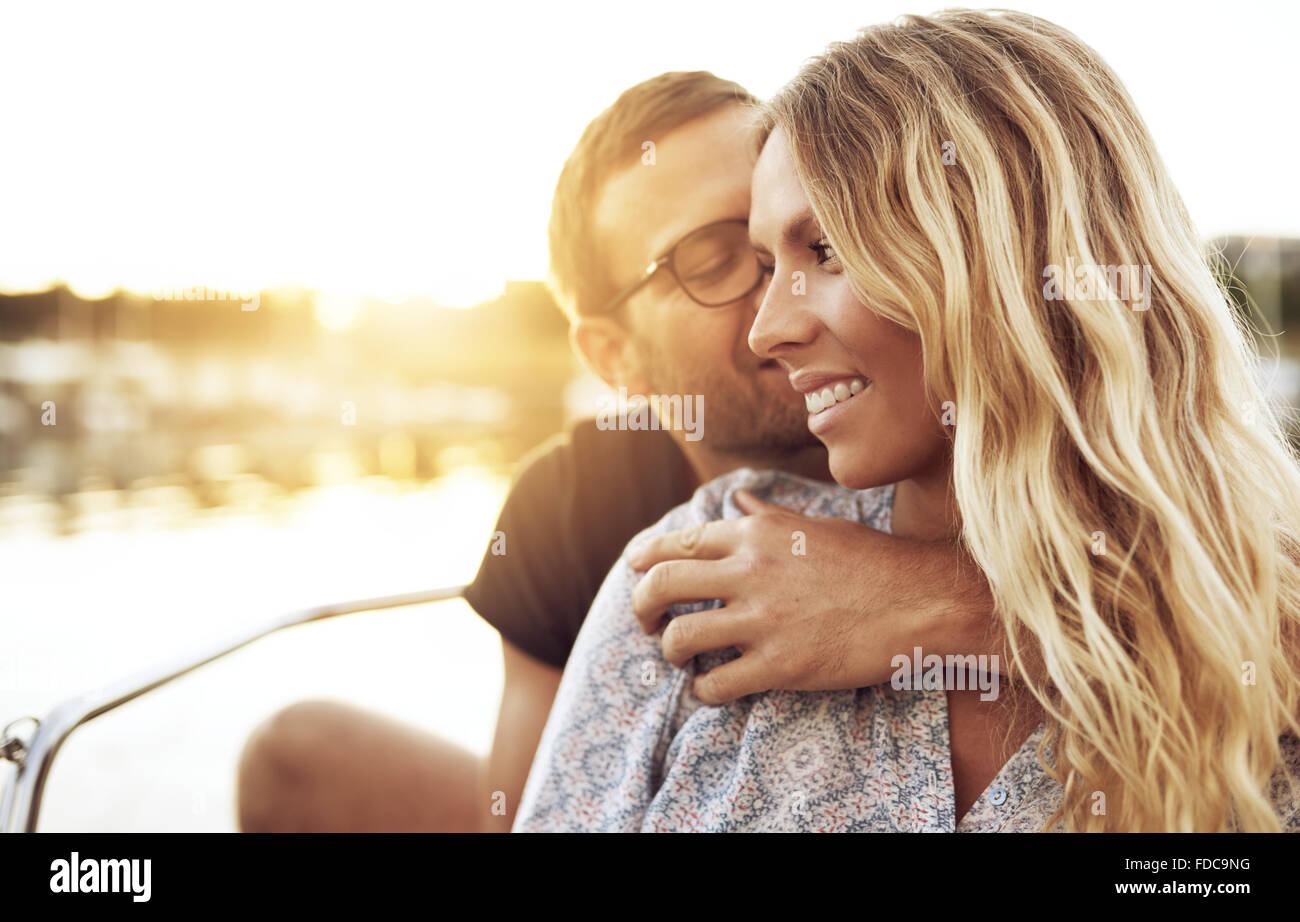 Man Kissing Woman while Woman Smiling Gently Stock Photo - Alamy