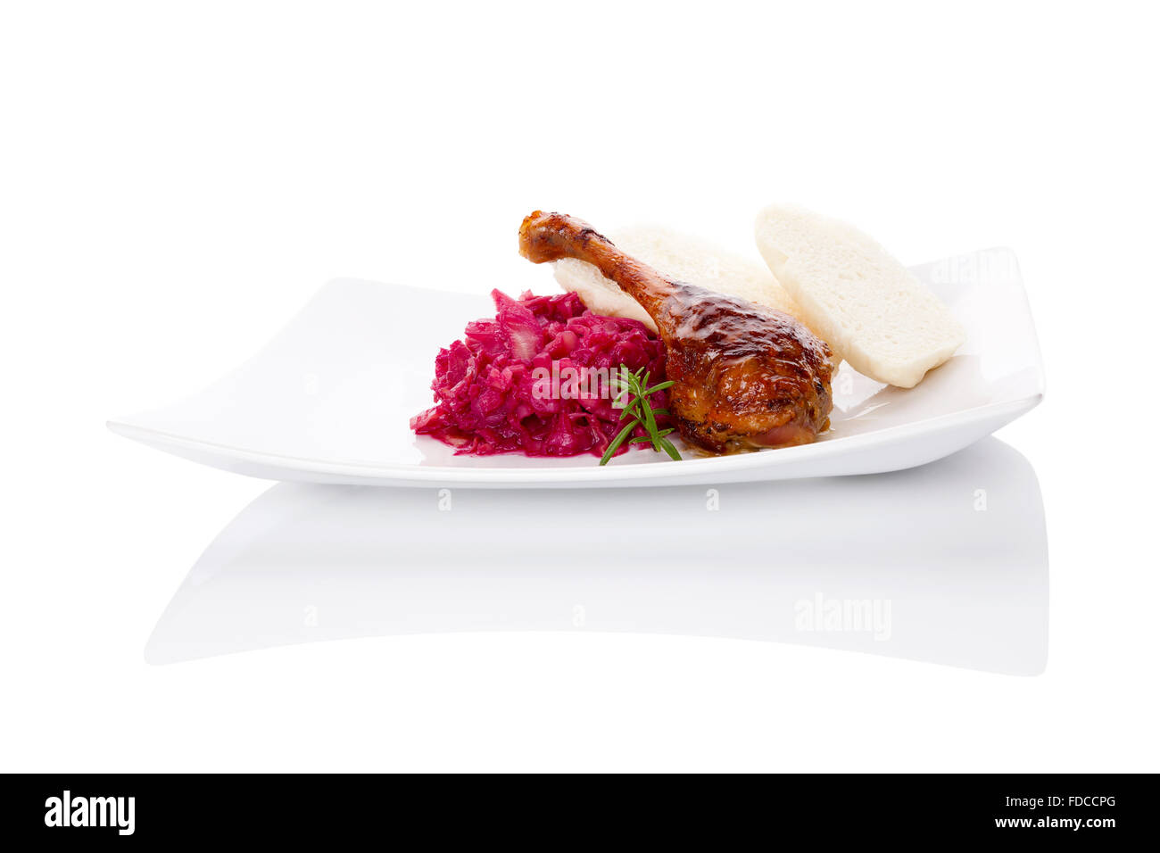 Delicious roast duck with red cabbage and dumplings. Traditional ...