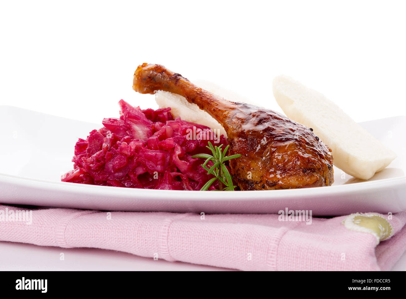 Delicious roast duck with red cabbage and dumplings. Traditional ...