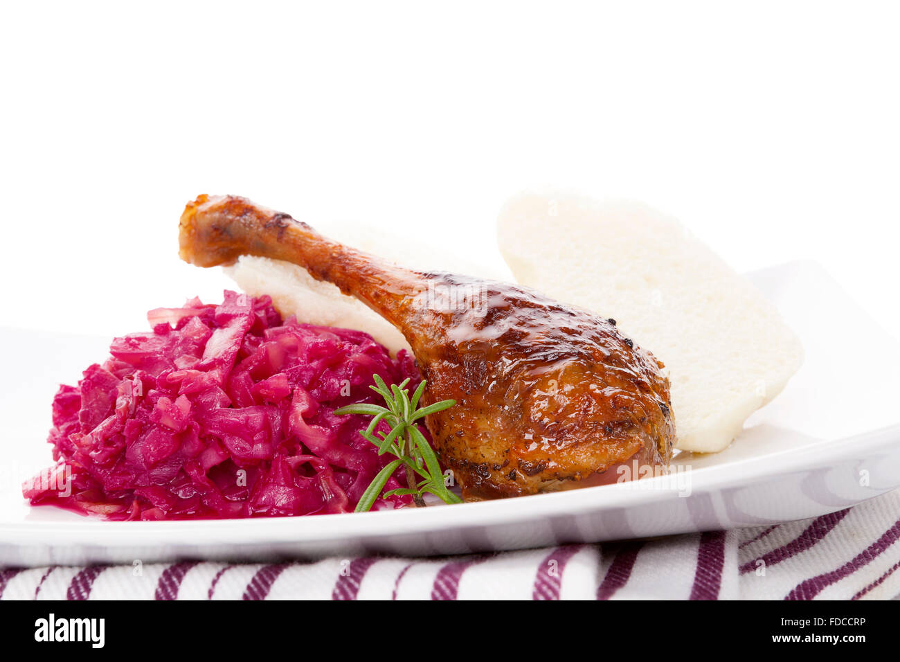 Delicious roast duck with red cabbage and dumplings. Traditional ...