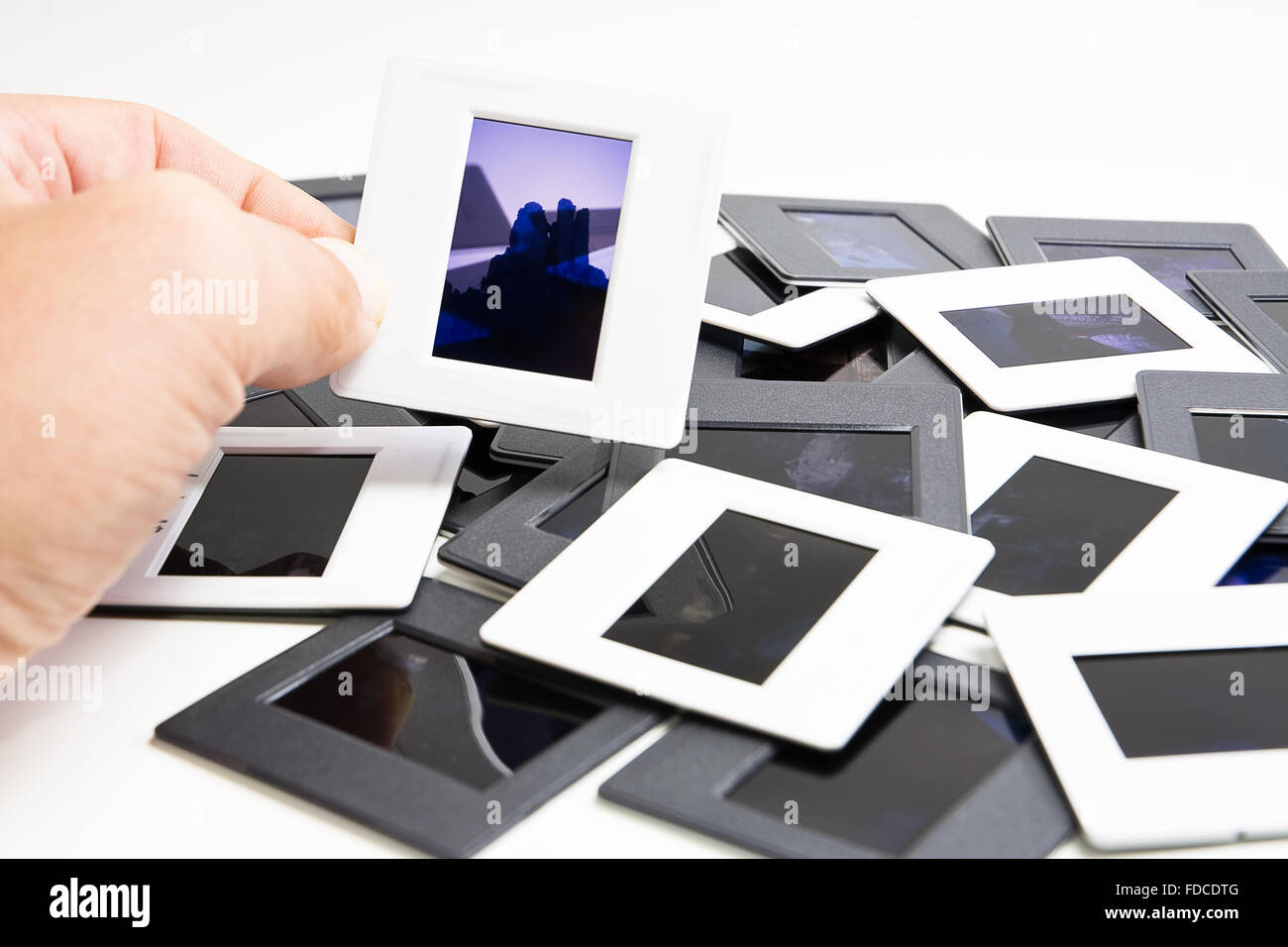 Frame in the hand with diapositive in background Stock Photo - Alamy