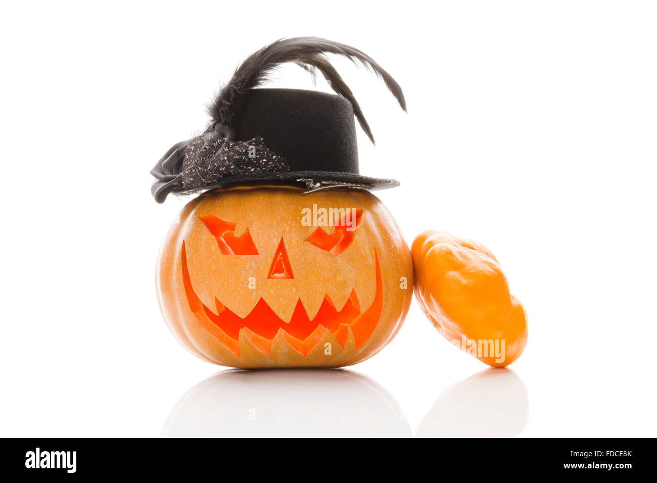Creepy halloween pumpkin with hat isolated on white background ...