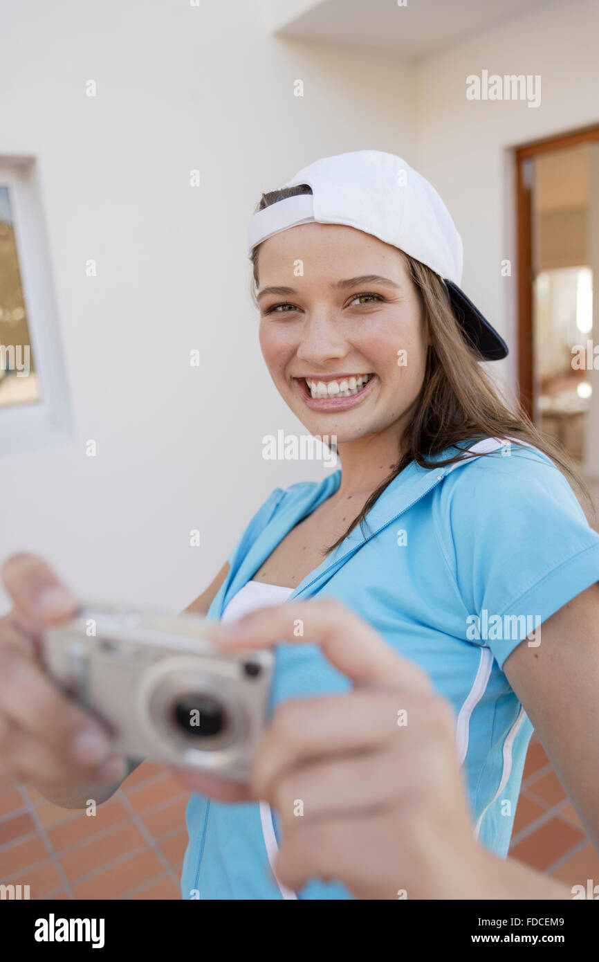 Young woman using digital camera Stock Photo - Alamy